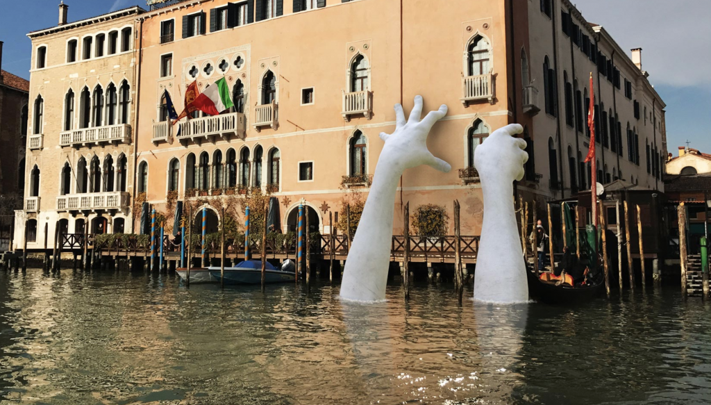 Huge Hands Rise Out of Venice's Waters to Support the City Threatened ...