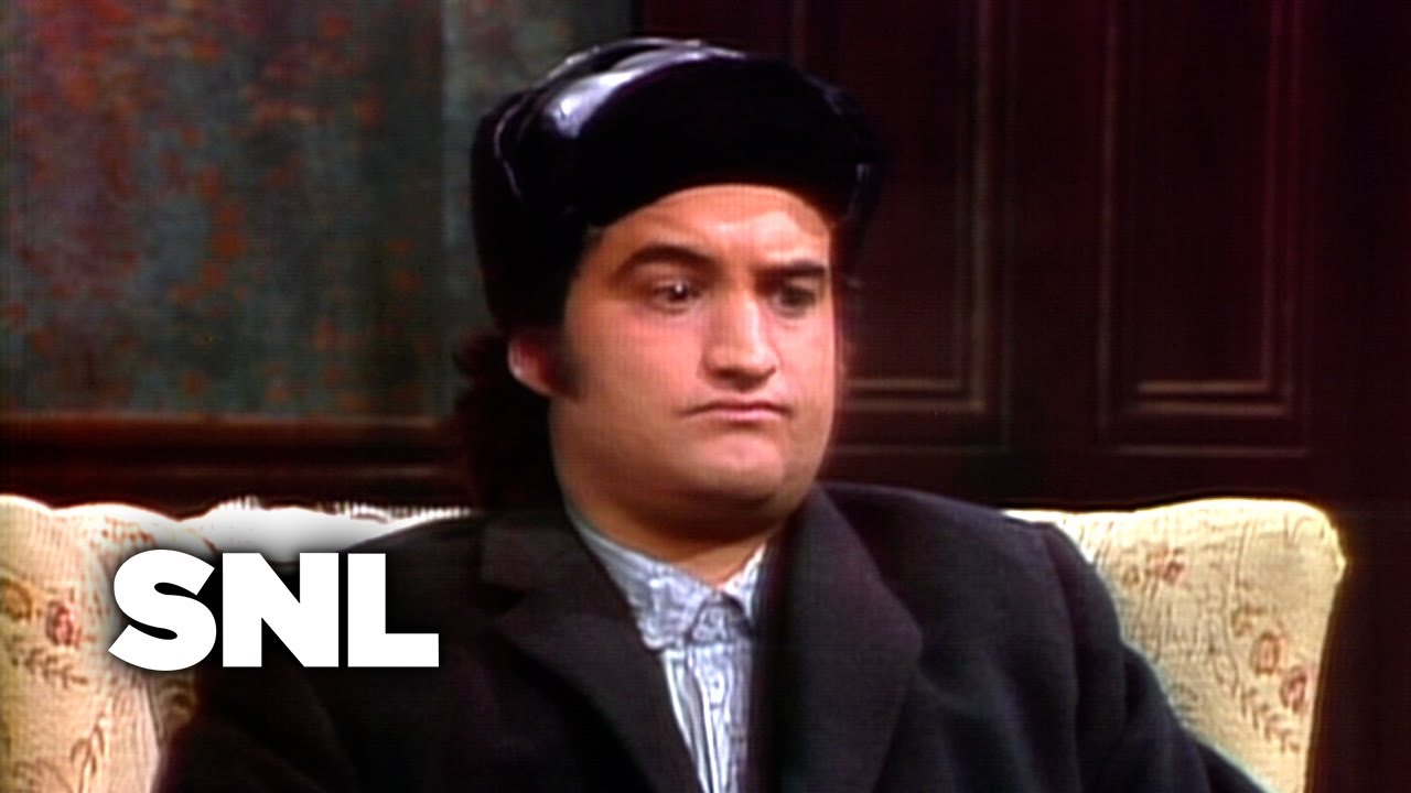 Saturday Night Live’s Very First Sketch: Watch John Belushi Launch SNL ...